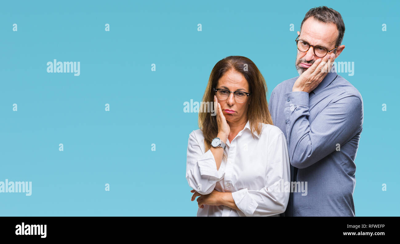 Middle age hispanic couple in love wearing glasses over isolated ...