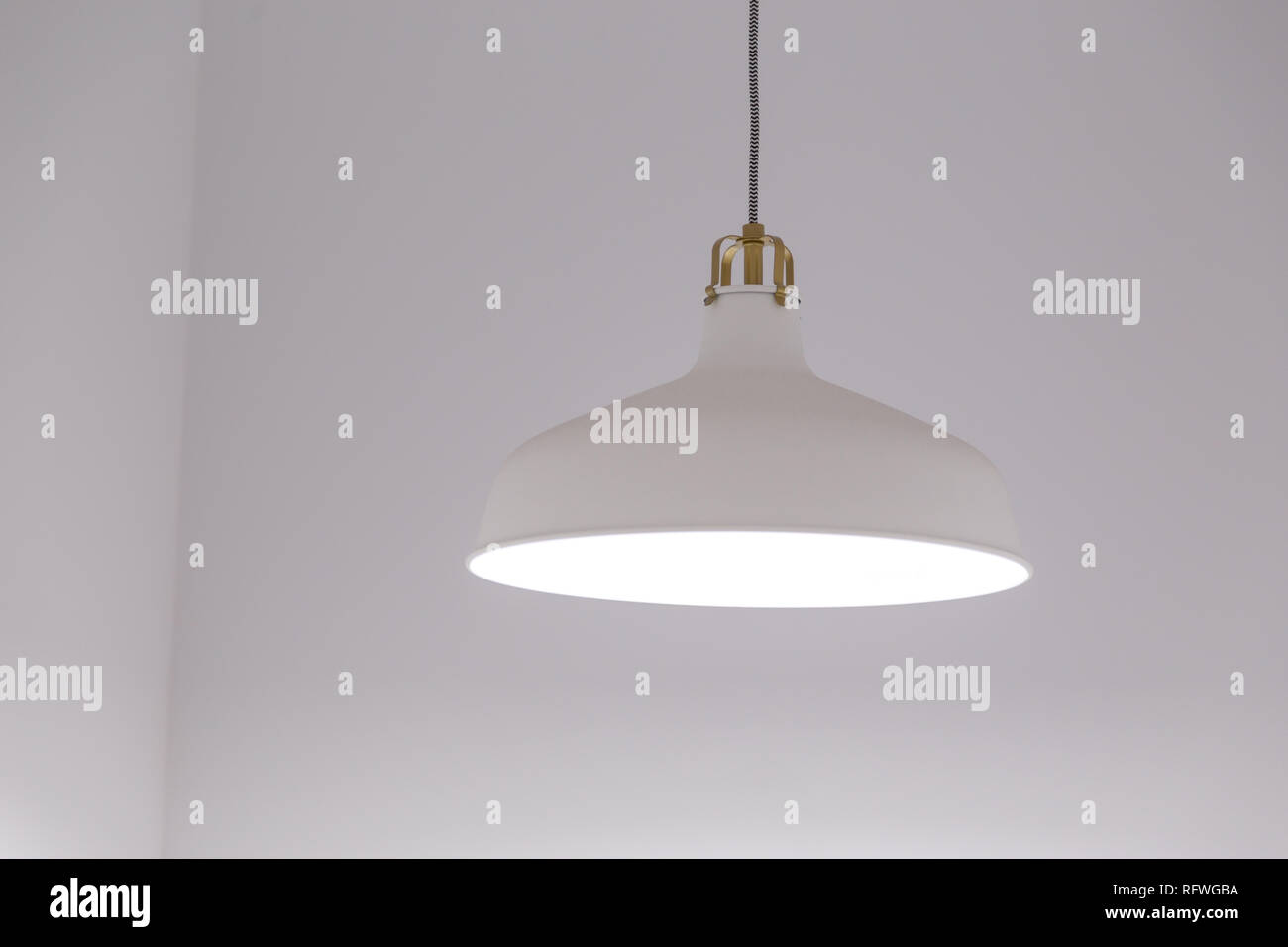 White lighting fixture with white wall background Stock Photo - Alamy