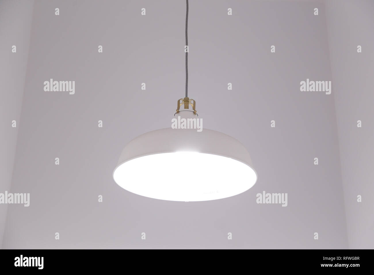 White lighting fixture with white wall background Stock Photo - Alamy