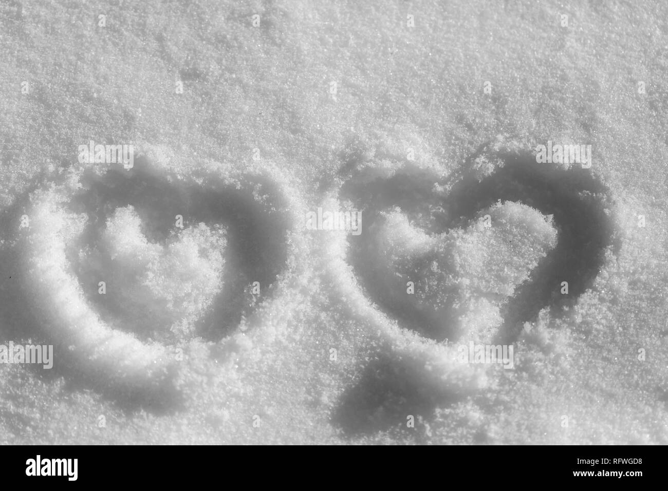 The shape of heart on the snow Stock Photo - Alamy