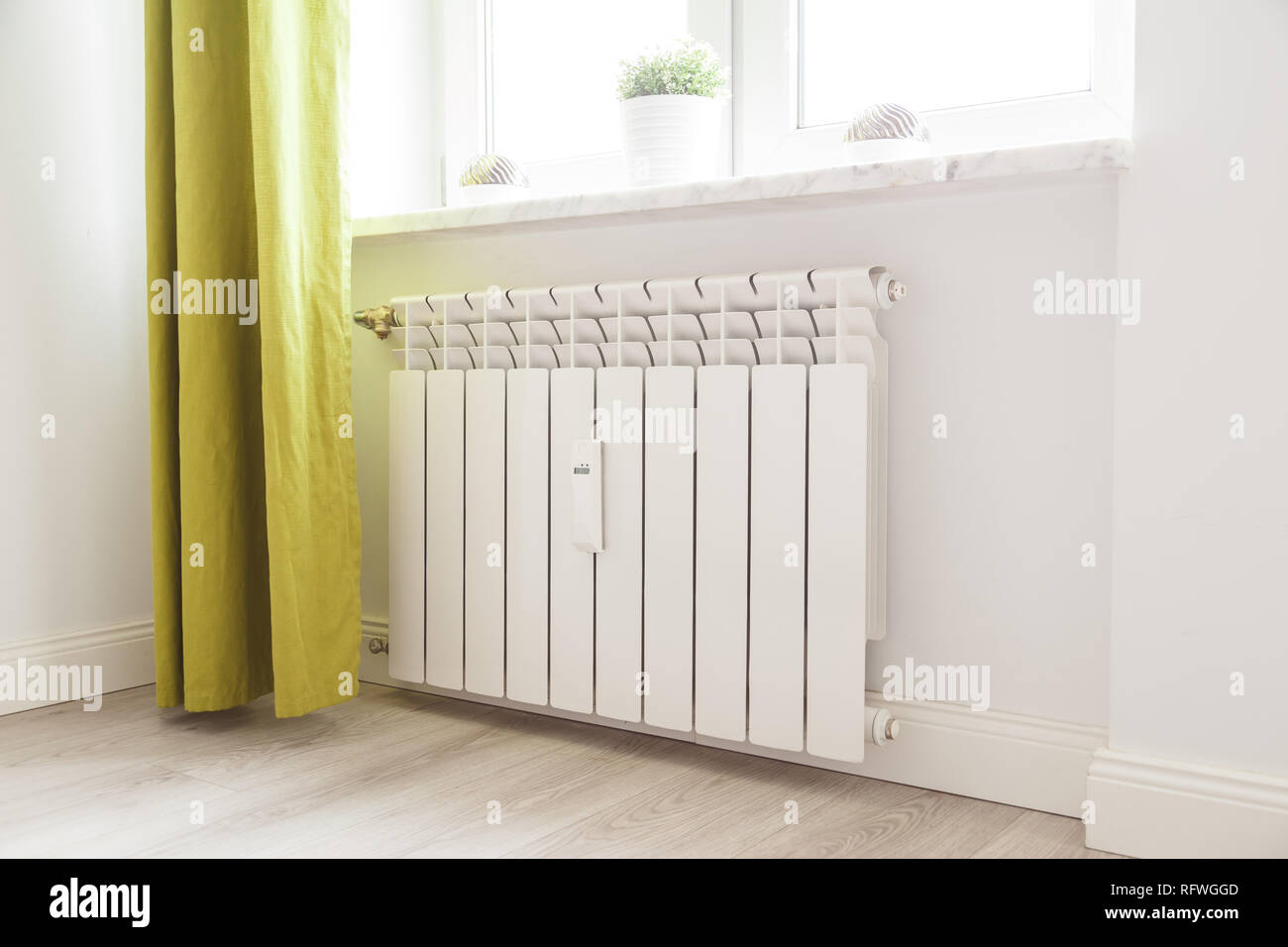 Heating white radiator radiator in living room Stock Photo - Alamy