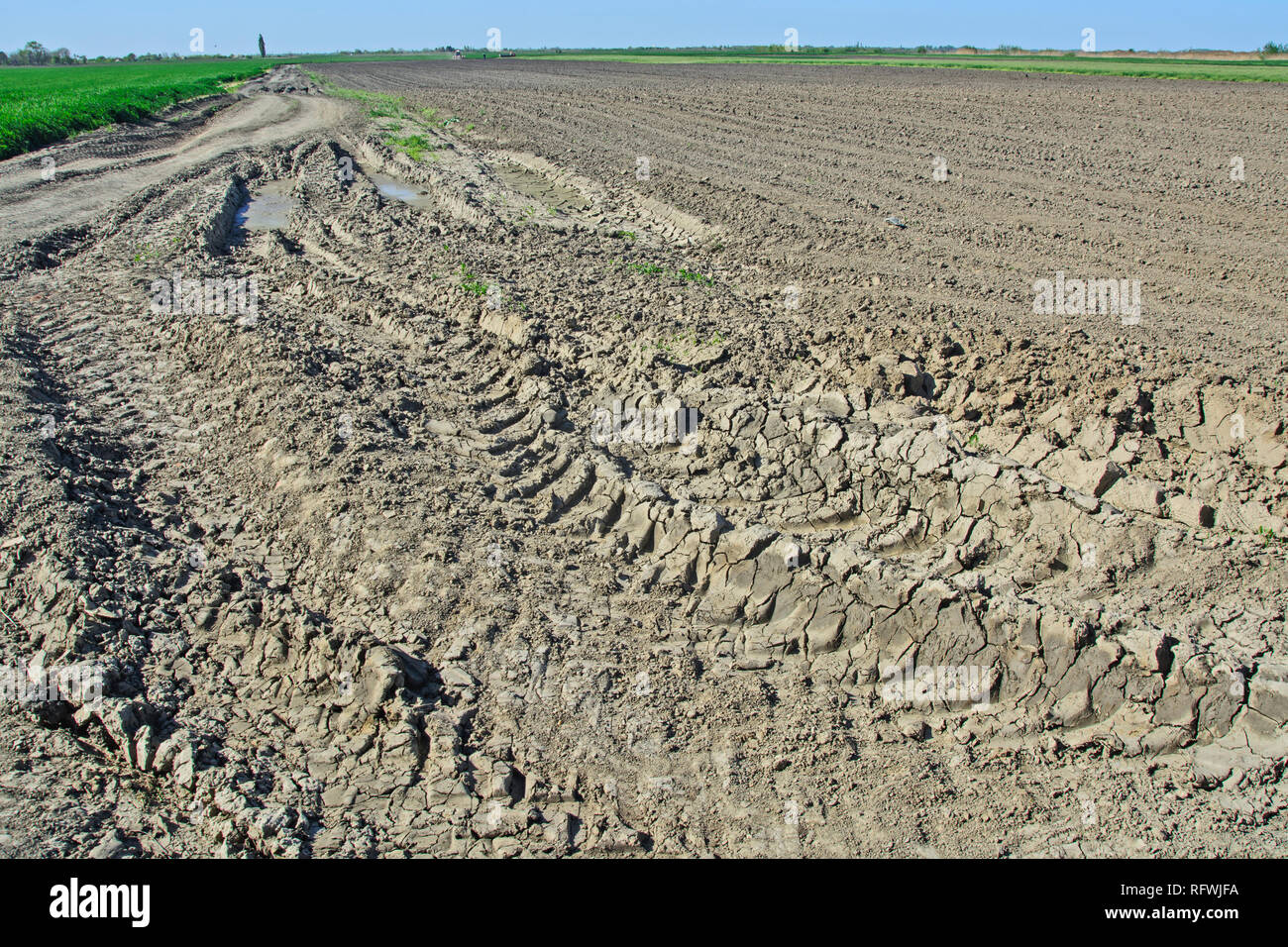 Rural old tractor path through fields where passing heavy machinery ...