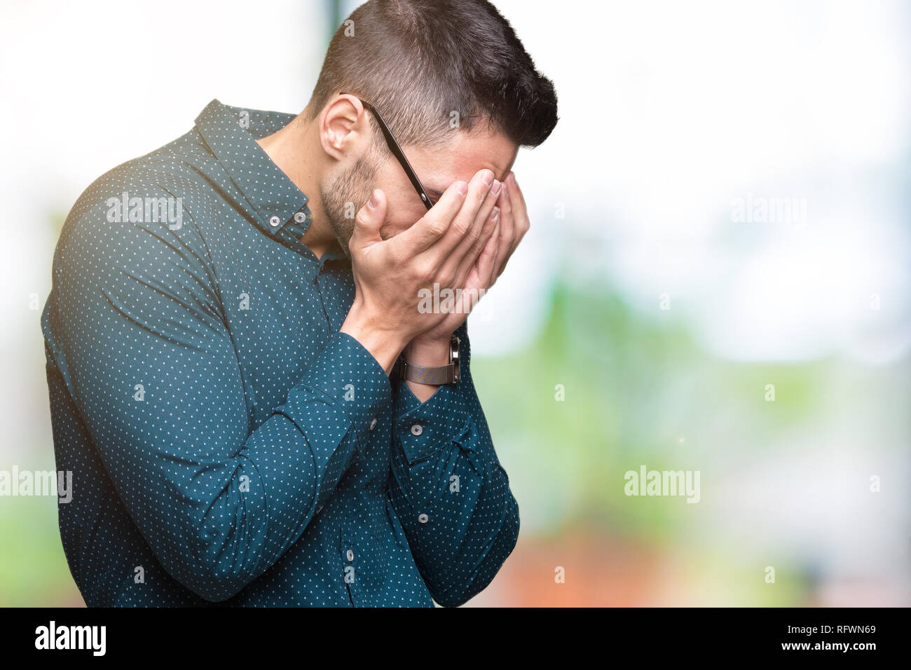 Young handsome business man wearing glasses over isolated background ...