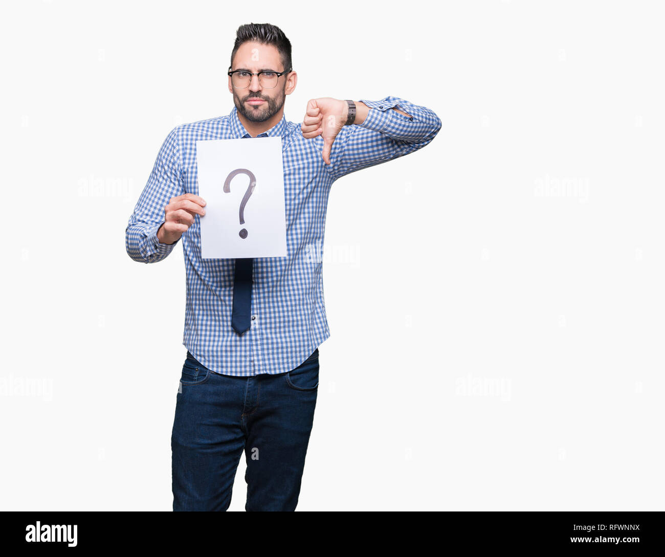Handsome young business man holding paper with question mark over ...