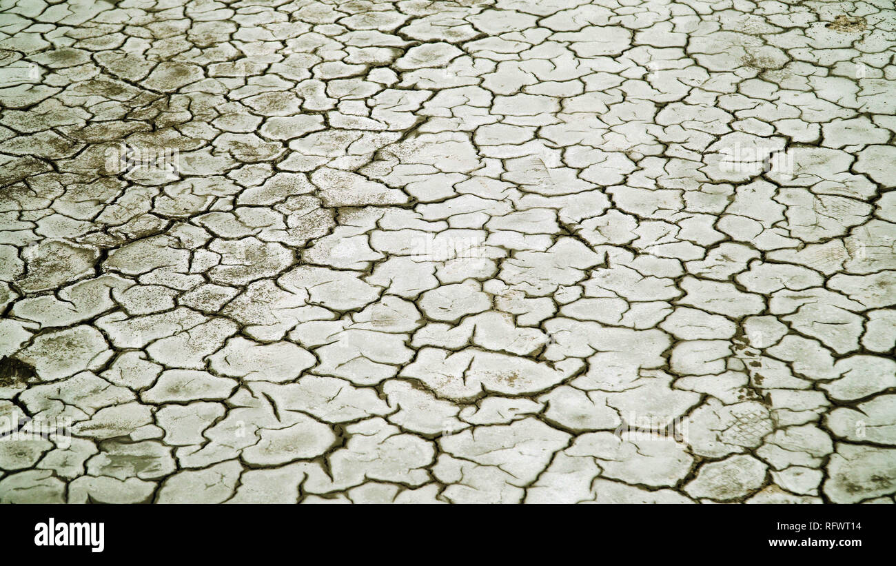 Dry cracked soil, Arid climate. Volcanic landscape around volcano ...