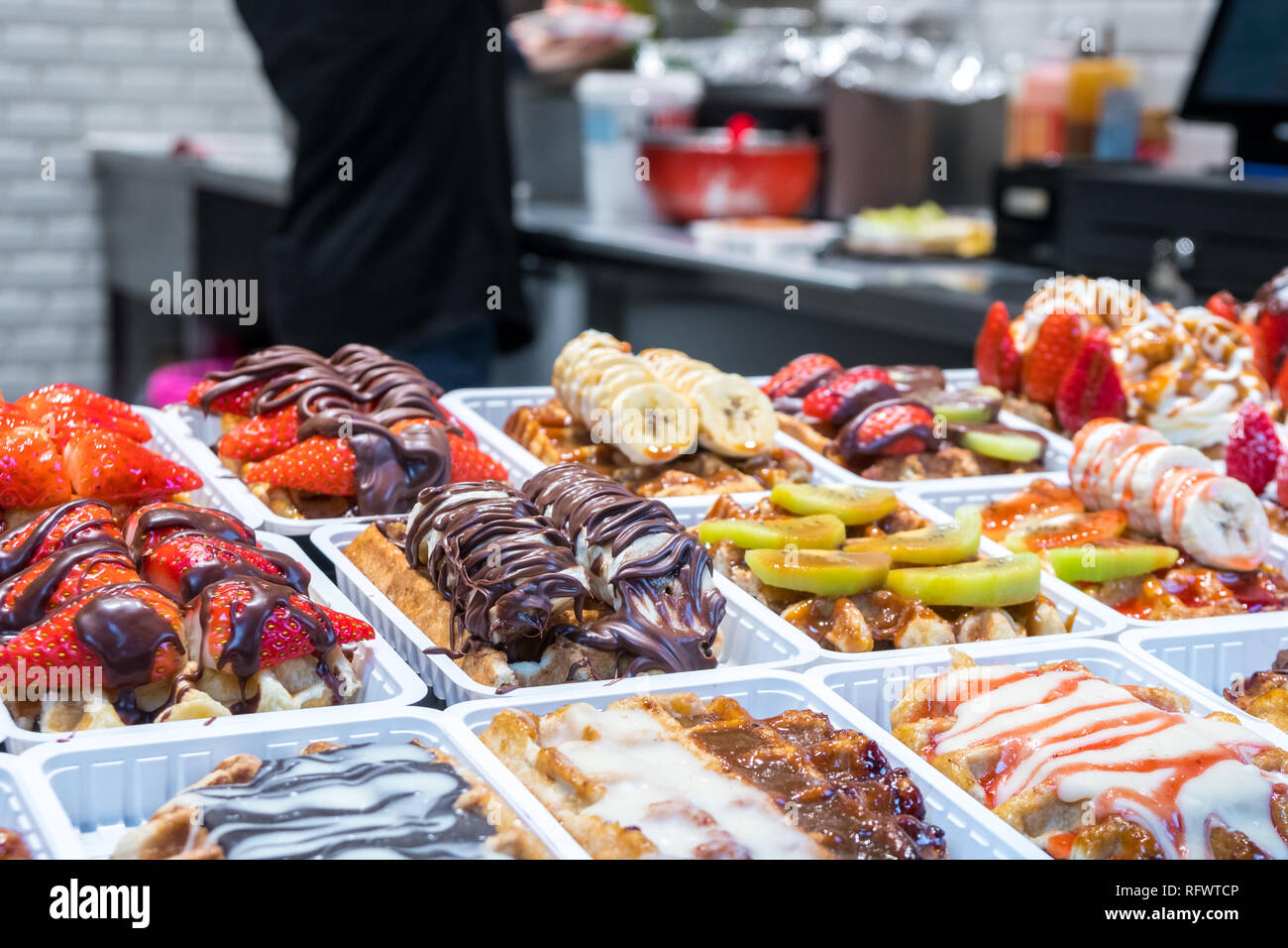 colorful cake sweet dessert with whipped cream at a street food market ...