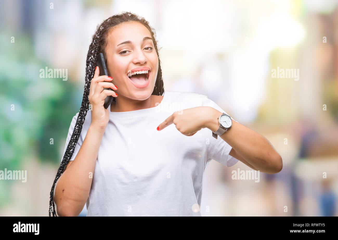 Young braided hair african american girl showing calling using ...