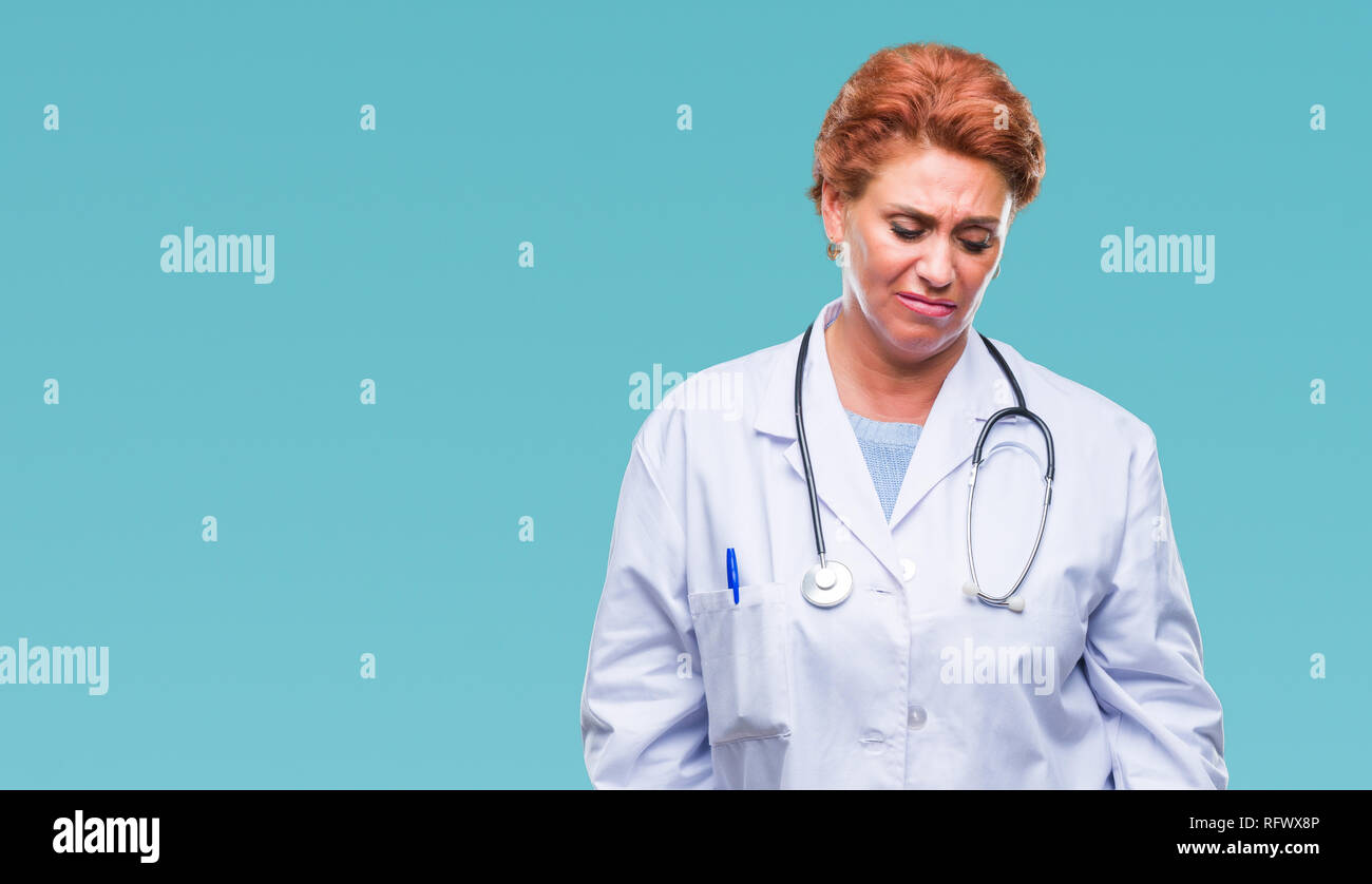 Senior caucasian doctor woman wearing medical uniform over isolated ...