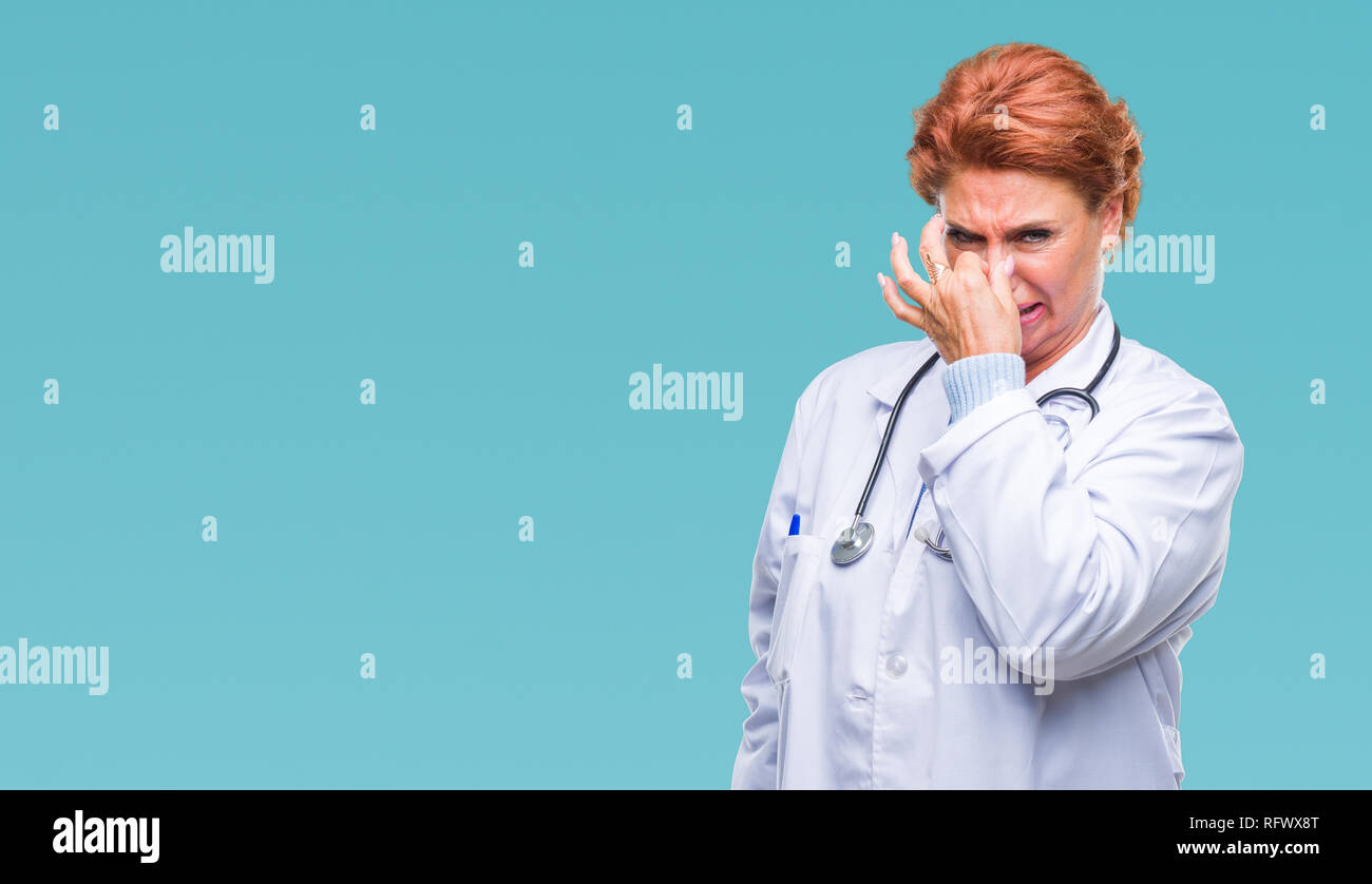 Senior caucasian doctor woman wearing medical uniform over isolated ...