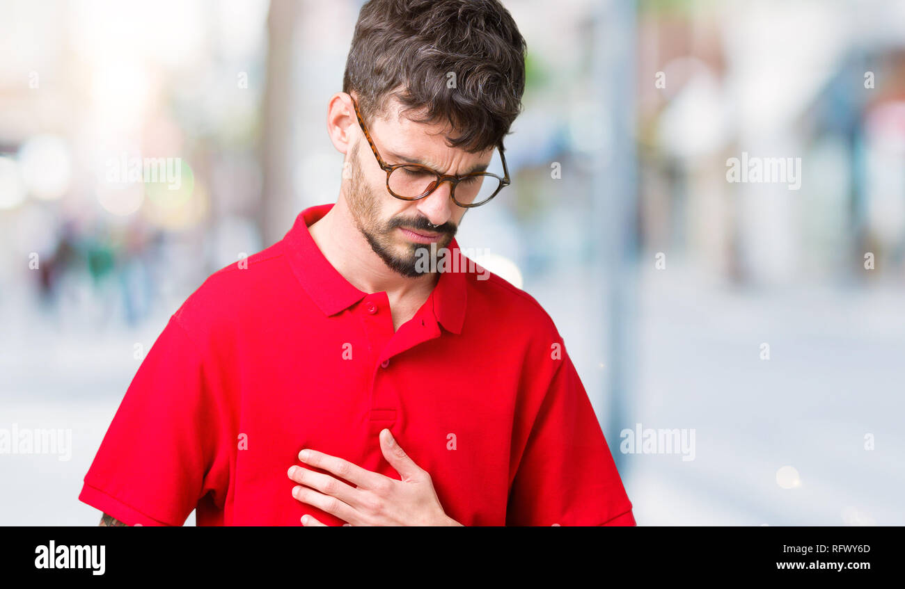 Young handsome man wearing glasses over isolated background with hand ...