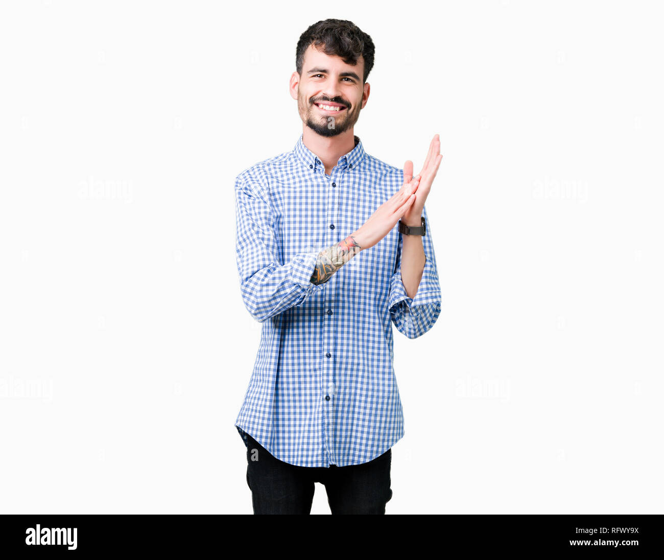 Young handsome business man over isolated background Clapping and ...