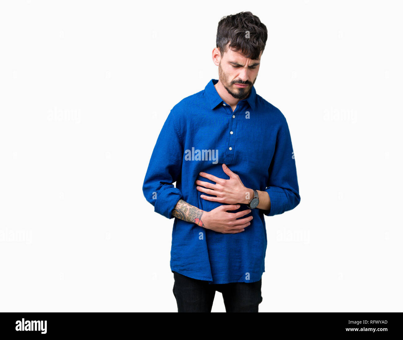 Young handsome man over isolated background with hand on stomach ...