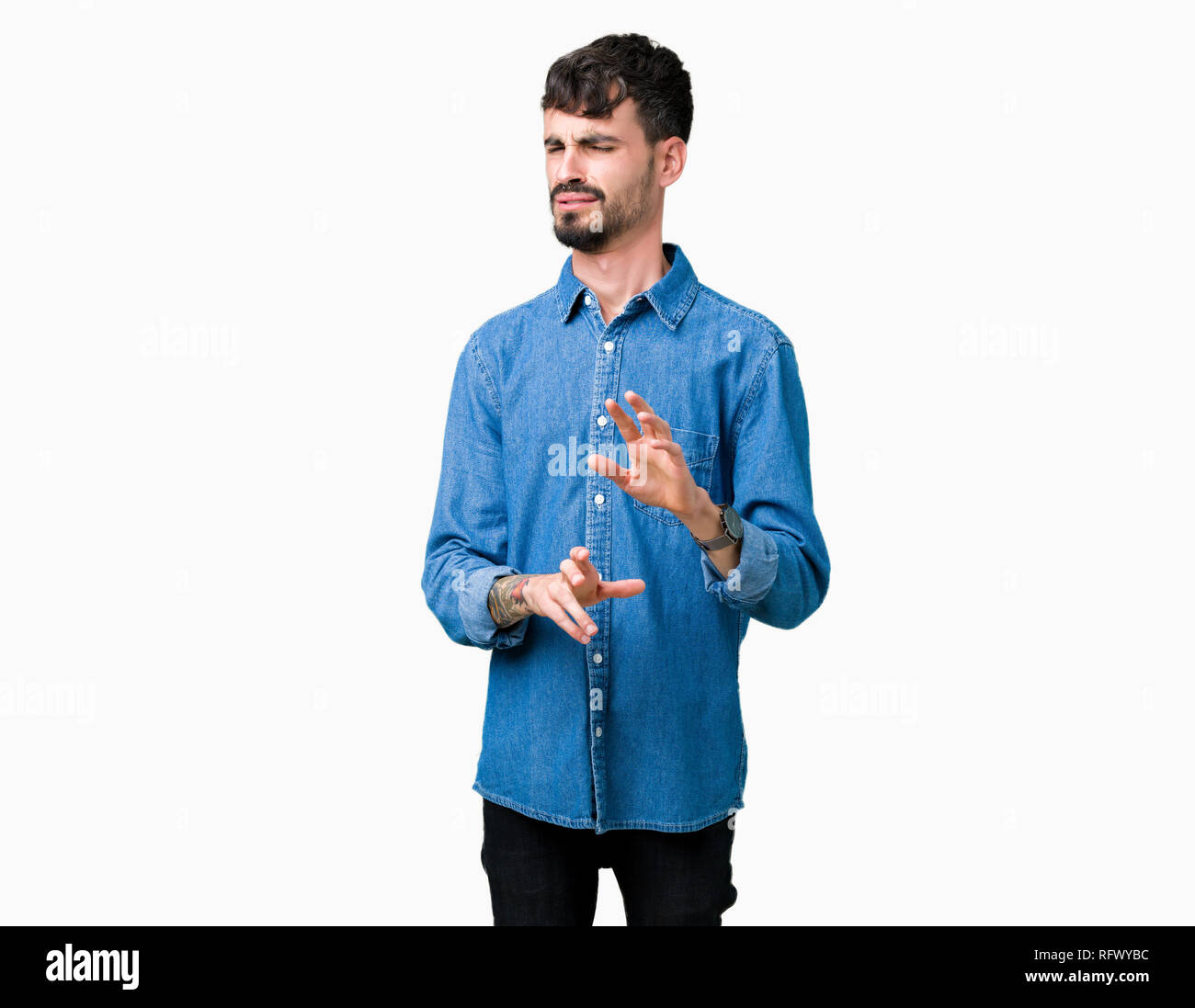 Young handsome man over isolated background disgusted expression ...