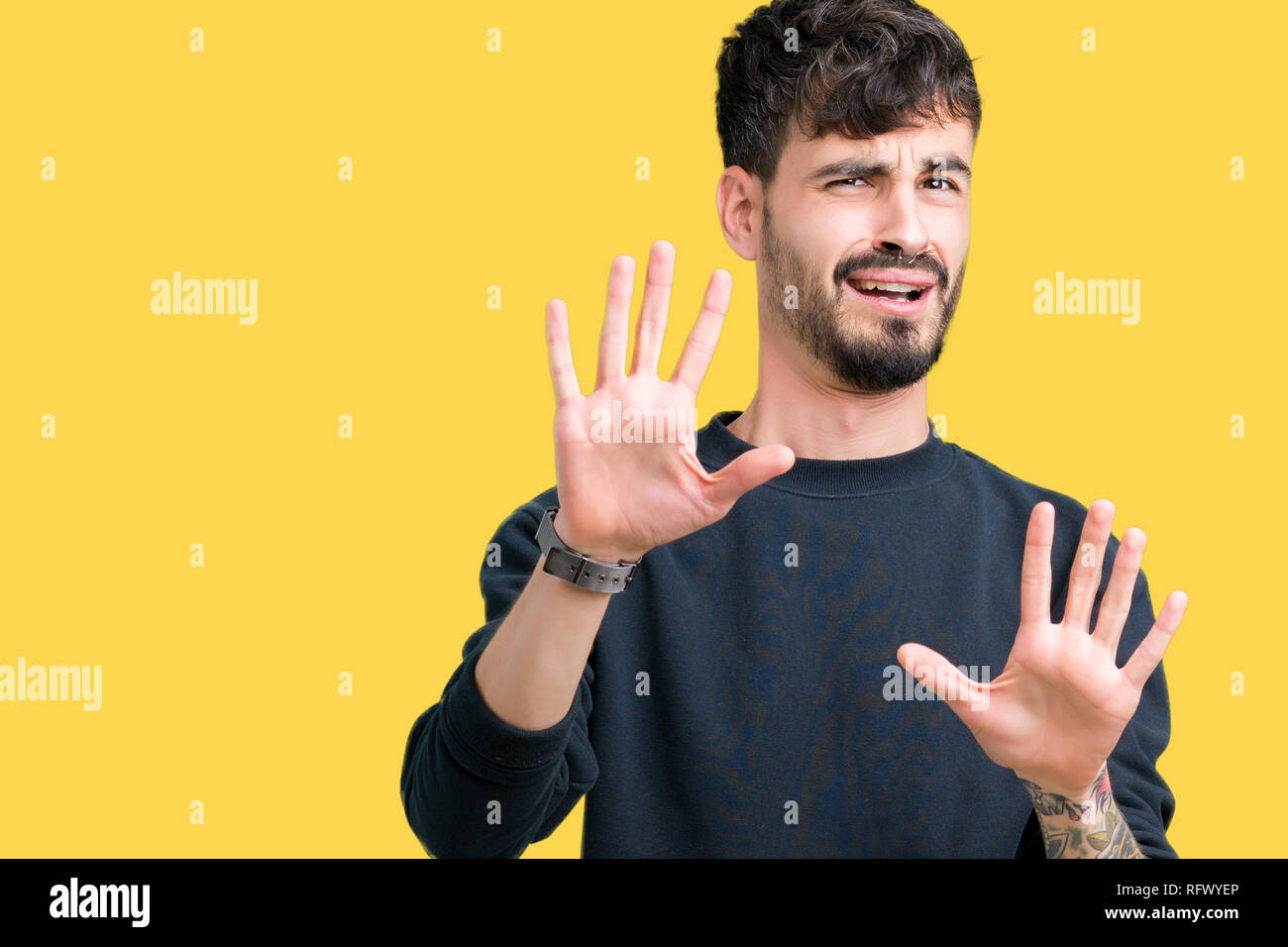 Young handsome man over isolated background afraid and terrified with ...