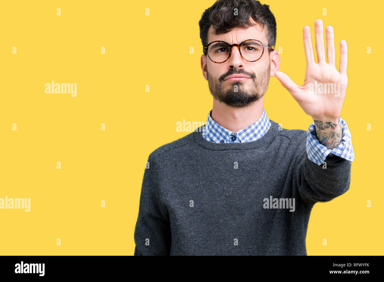 Young handsome smart man wearing glasses over isolated background doing ...
