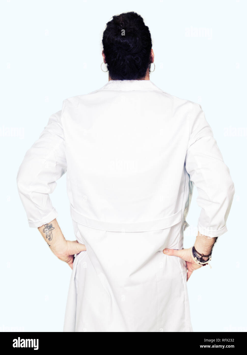 Doctor with long hair wearing medical coat and stethoscope standing ...