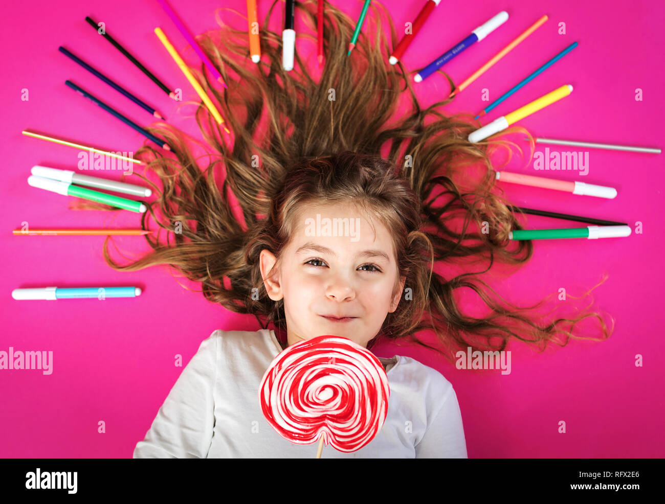 Little girl with color pencils Stock Photo - Alamy