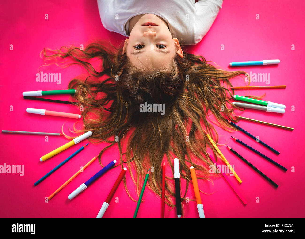 Little girl with color pencils Stock Photo - Alamy