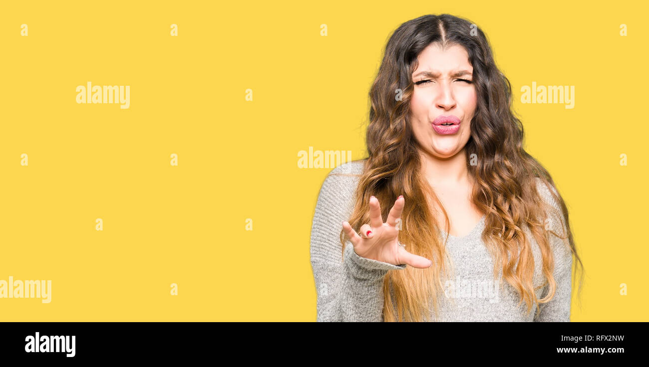 Young beautiful woman wearing winter dress disgusted expression ...