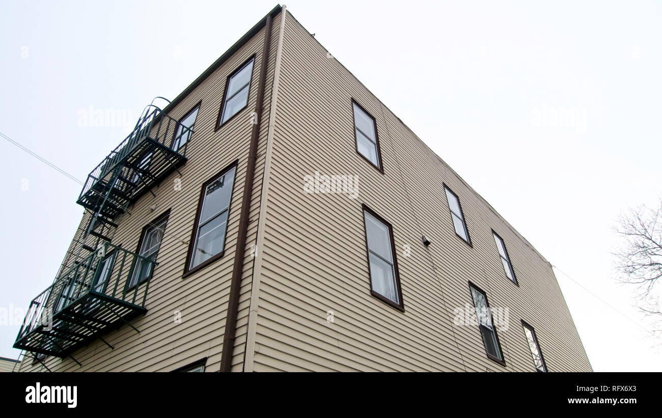 A profile of a 3-story residential house in a typical American suburb ...