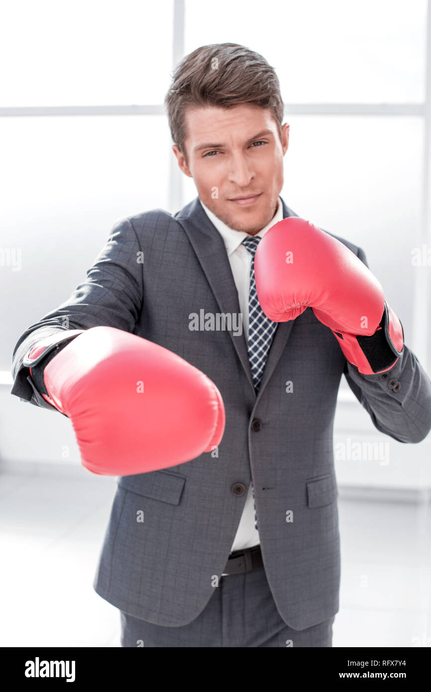businessman in Boxing gloves, standing near the office window Stock ...
