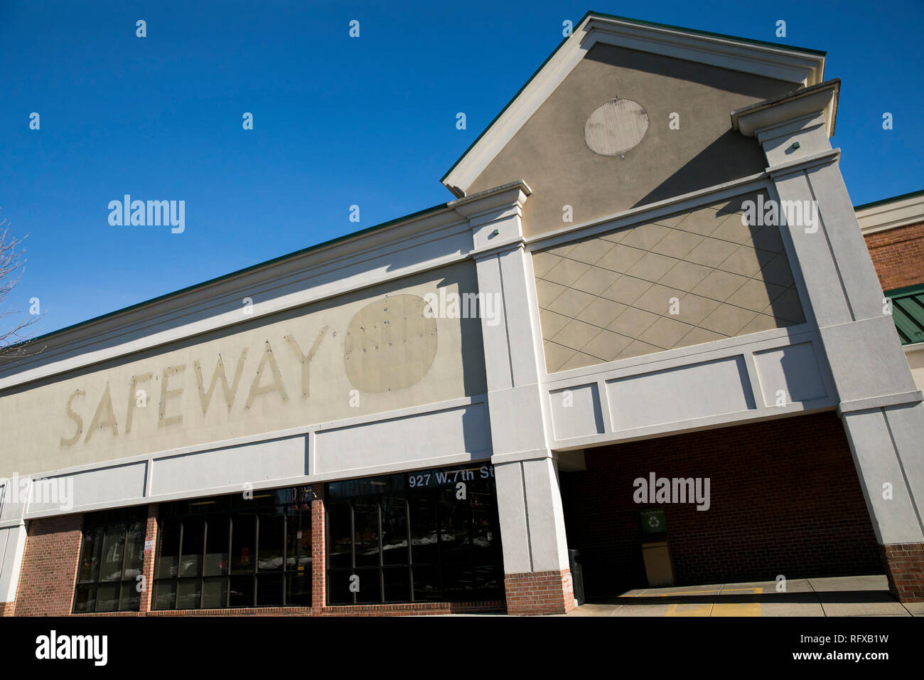 The outline of a logo sign outside of an abandoned Safeway grocery ...
