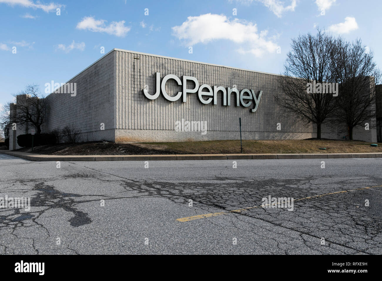 A logo sign outside of an abandoned JCPenney retail store location in ...