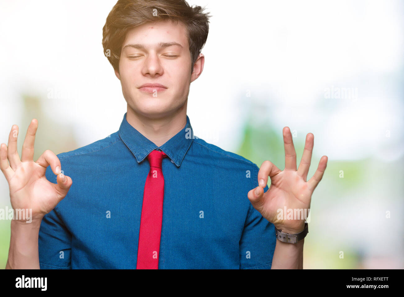 Young handsome business man wearing red tie over isolated background ...