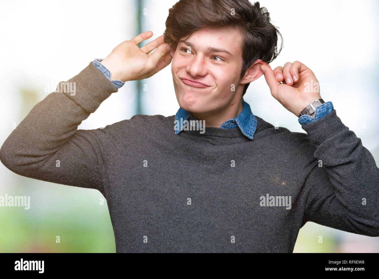 Boy pulling ear hi-res stock photography and images - Alamy