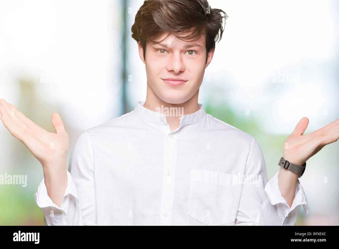 Young handsome business man over isolated background clueless and ...