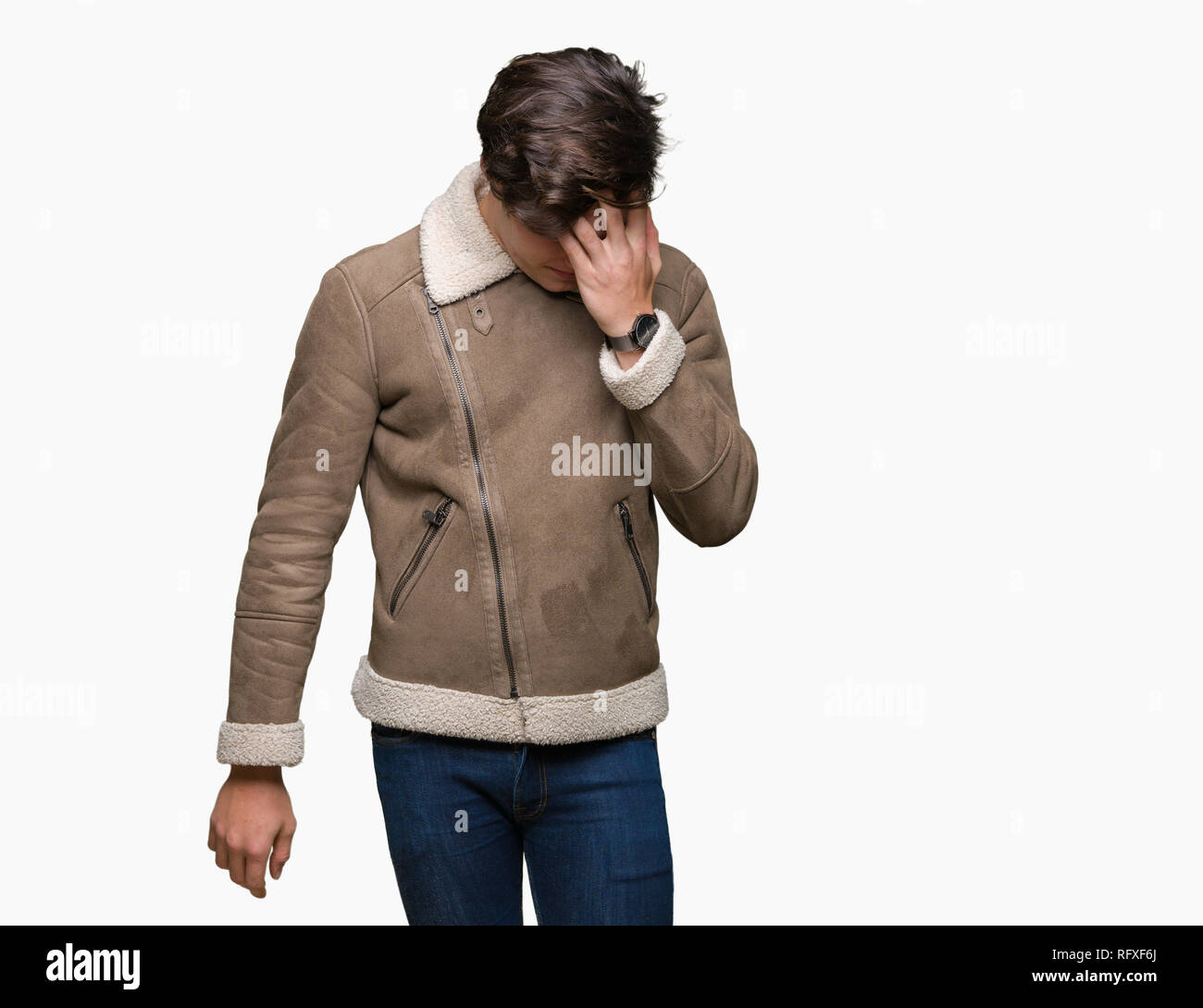 Young handsome man wearing winter coat over isolated background with ...