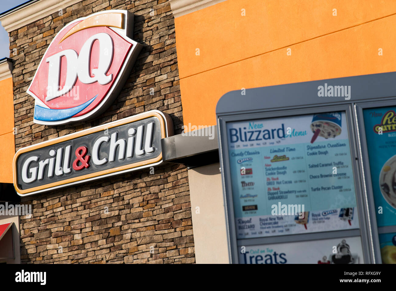 A logo sign outside of a Dairy Queen fast food restaurant location in ...