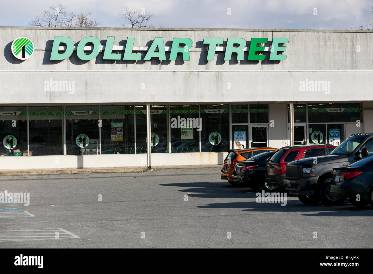 A logo sign outside of a Dollar Tree retail store location in ...