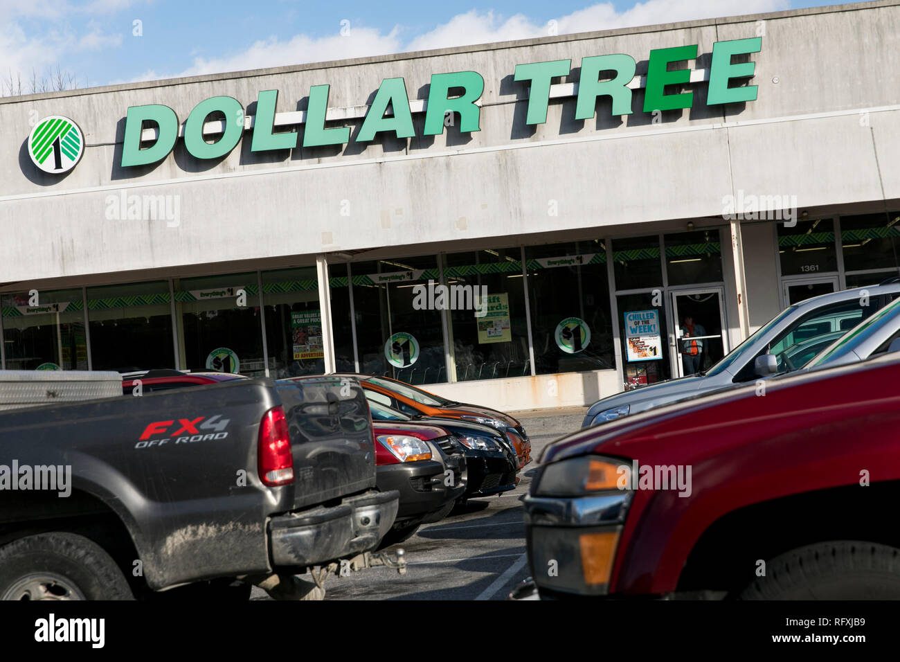 A logo sign outside of a Dollar Tree retail store location in ...