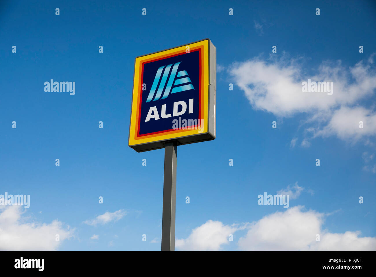 A logo sign outside of a Aldi retail grocery store location in ...