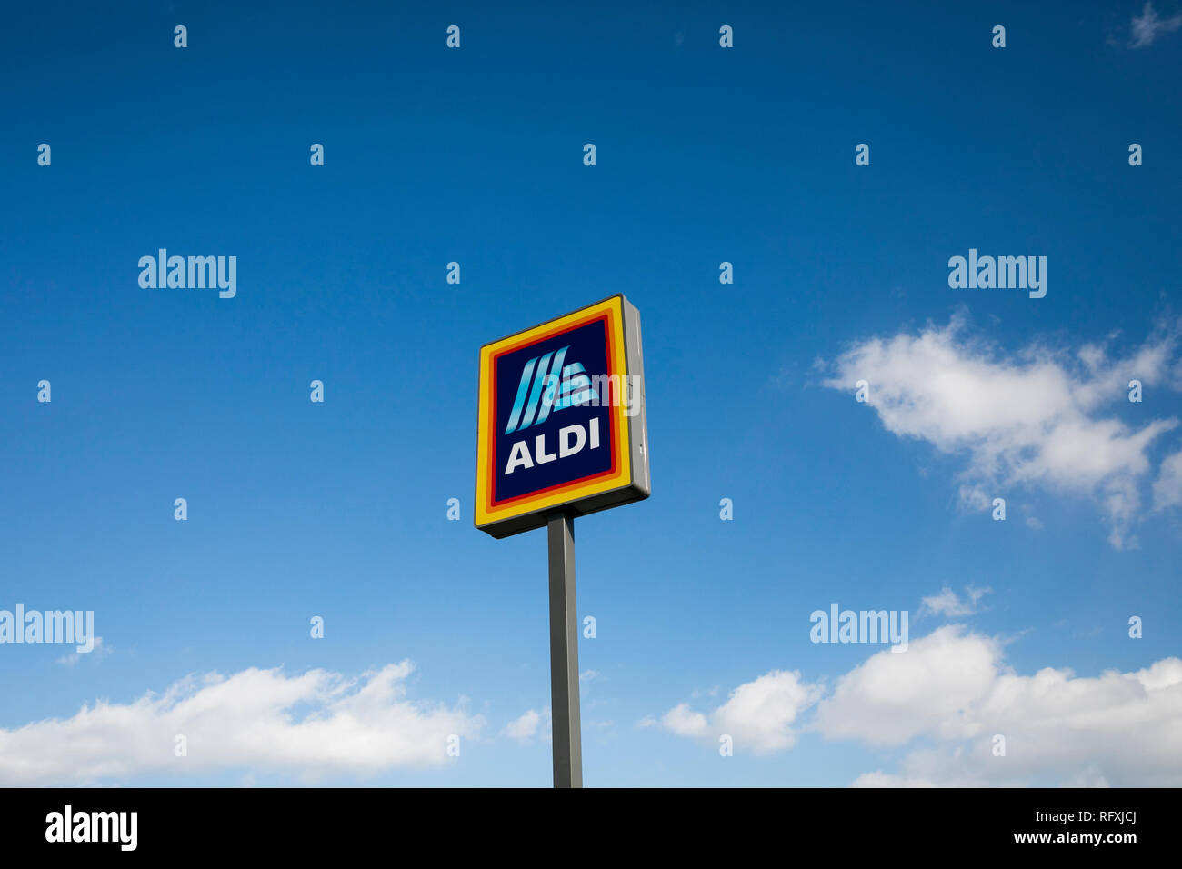 A logo sign outside of a Aldi retail grocery store location in ...