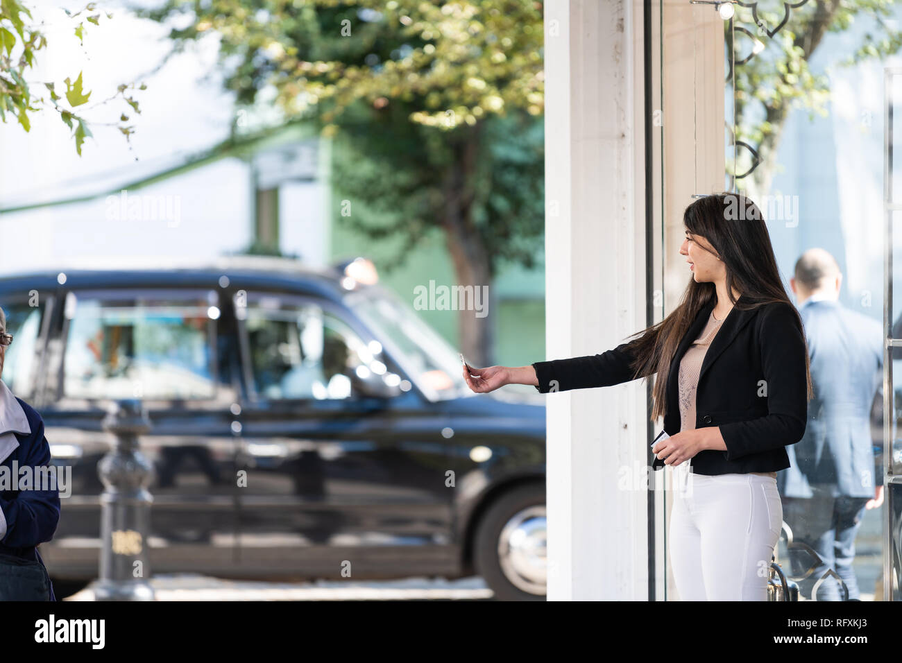 Woman giving out samples hi-res stock photography and images - Alamy
