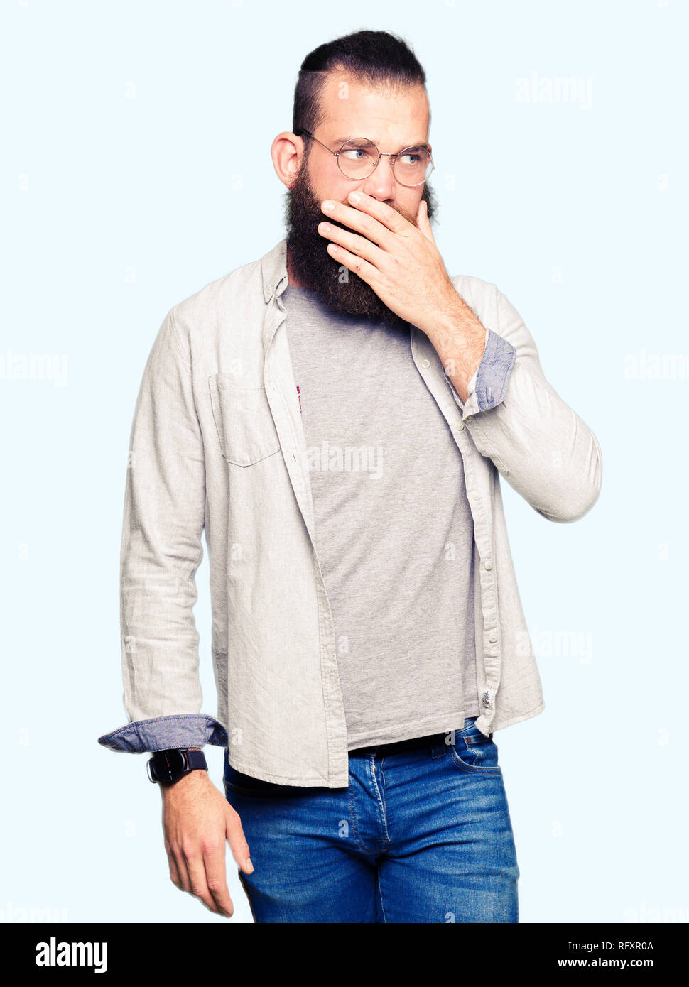 Young blond man wearing glasses looking stressed and nervous with hands ...