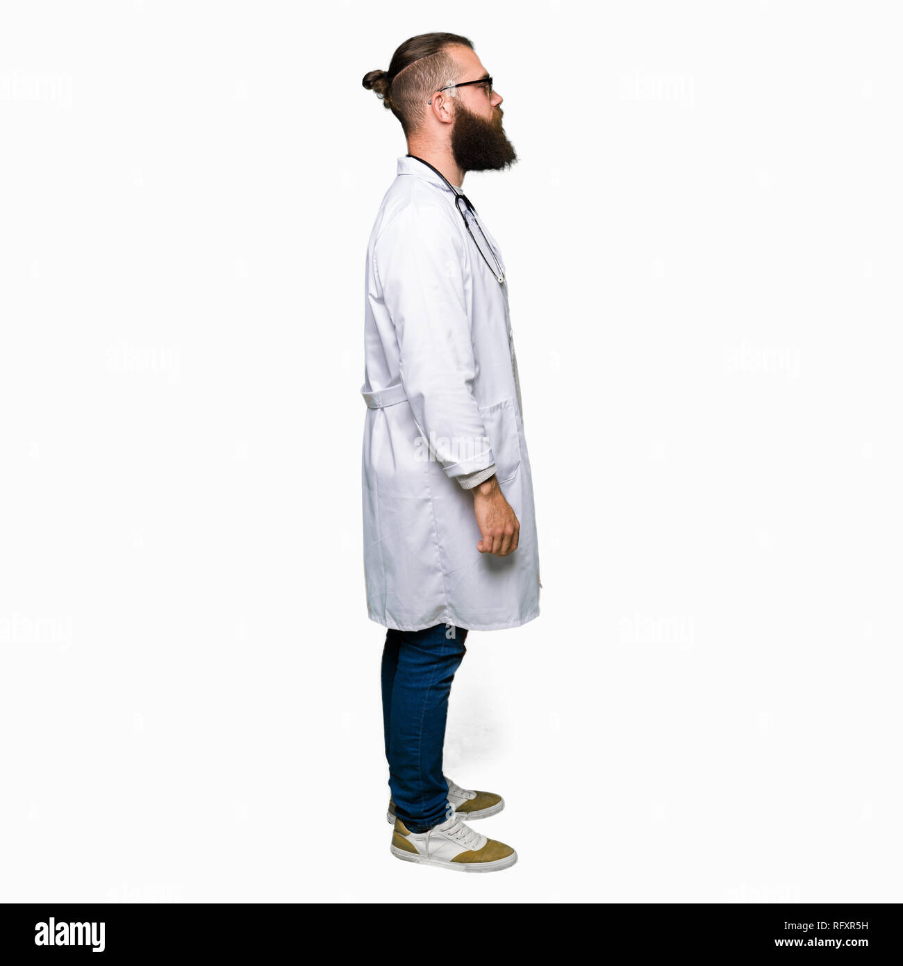 Young blond doctor man with beard wearing sunglasses looking to side ...