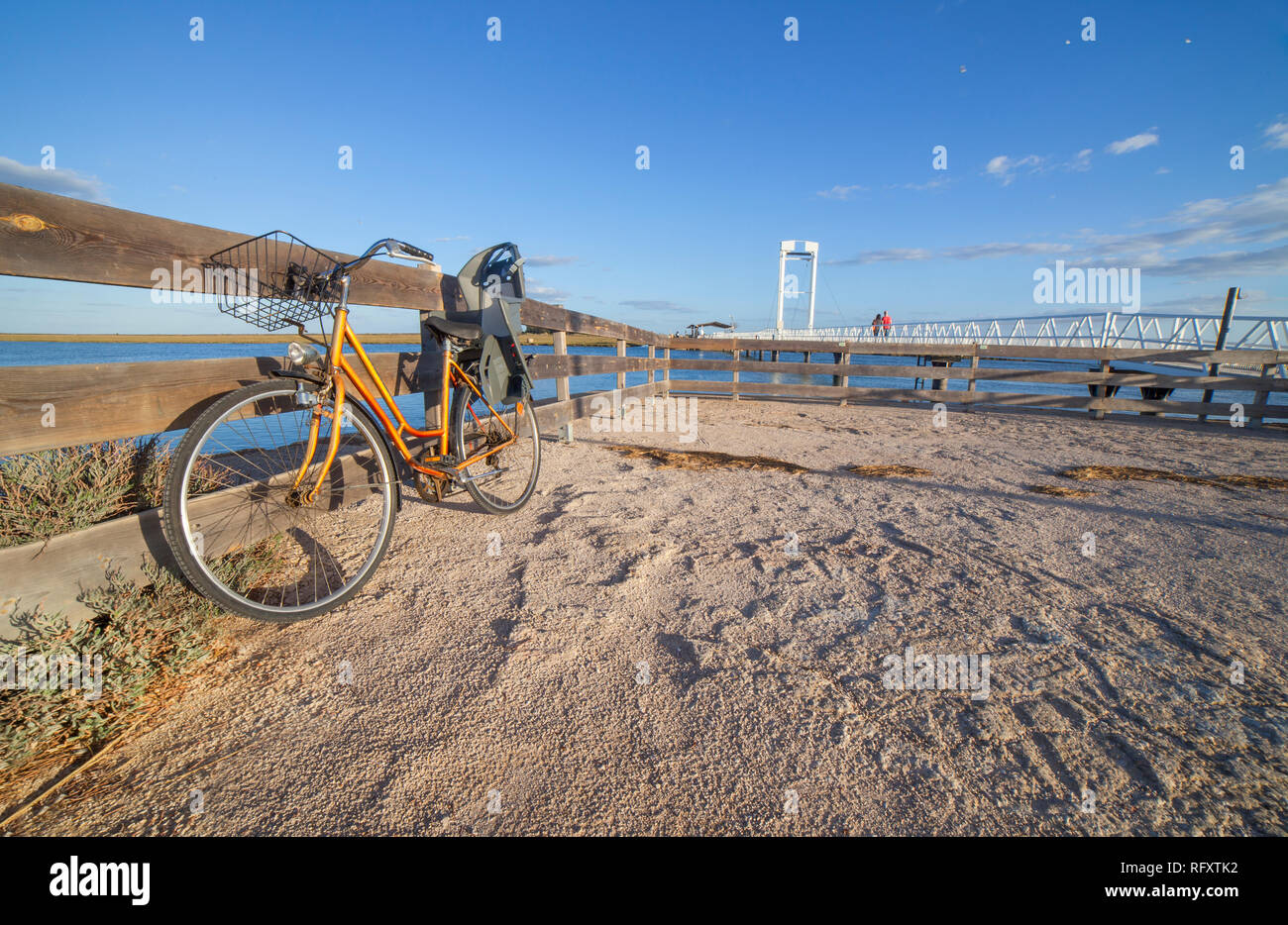Bike with Child Bike Carrier parked beside Tavira Island pedestrian ...