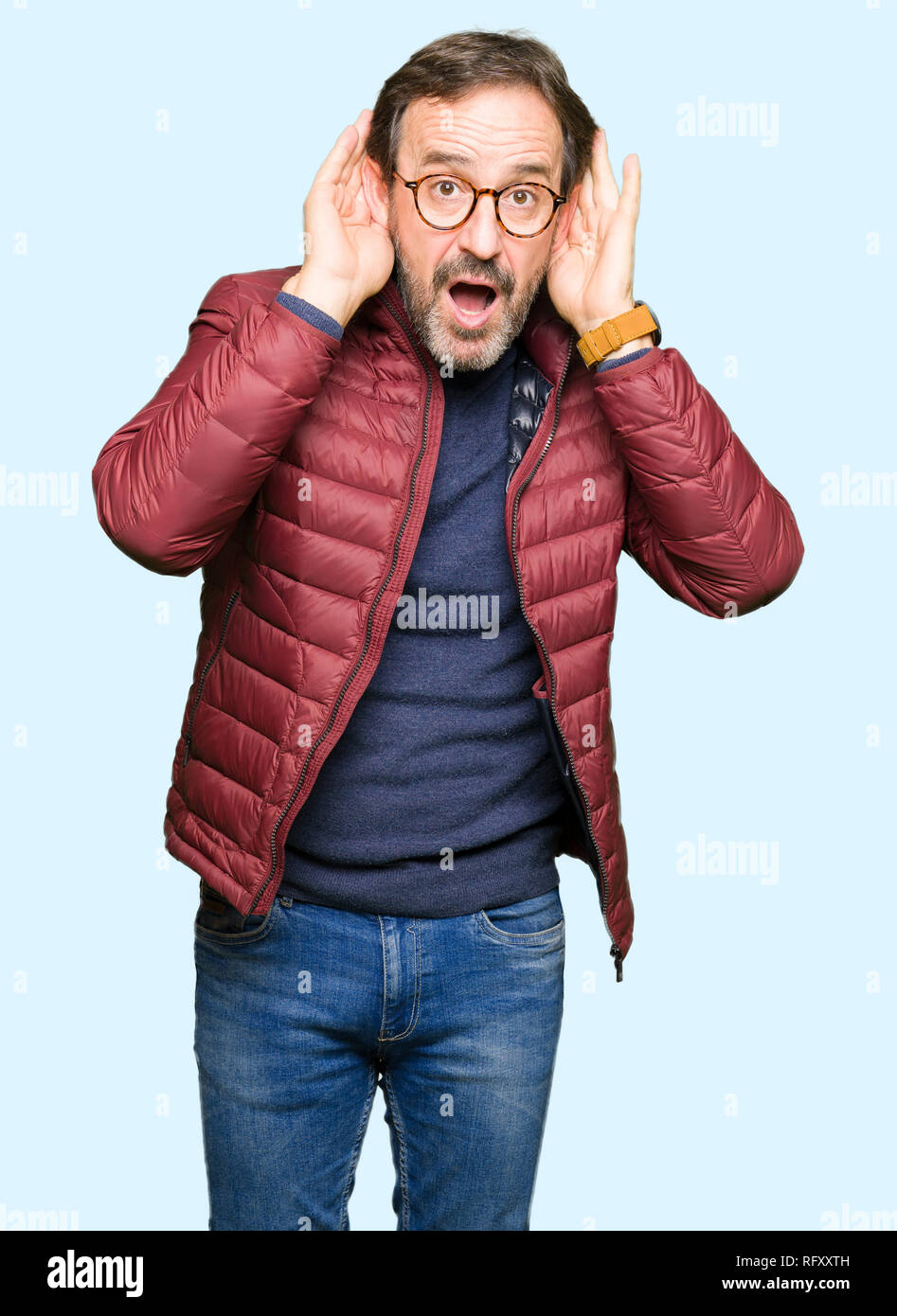 Middle age handsome man wearing glasses and winter coat Trying to hear ...