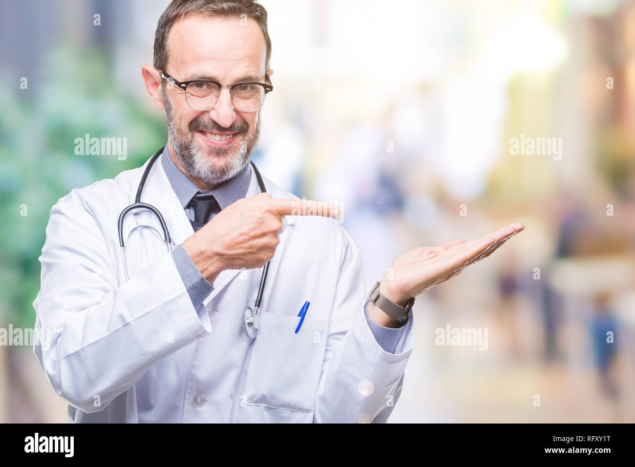 Middle age senior hoary doctor man wearing medical uniform isolated ...