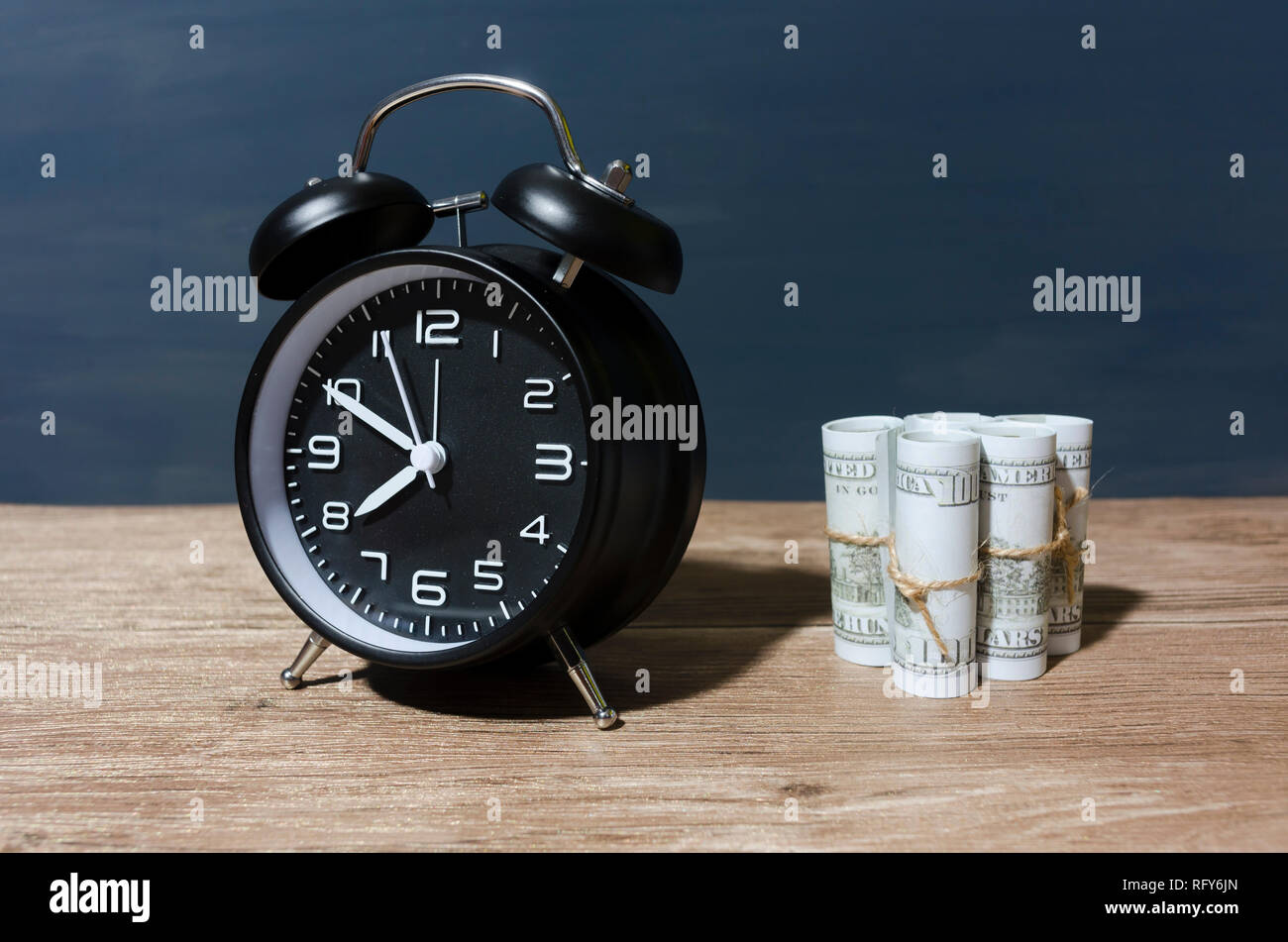 Clock and money, precious time Stock Photo - Alamy