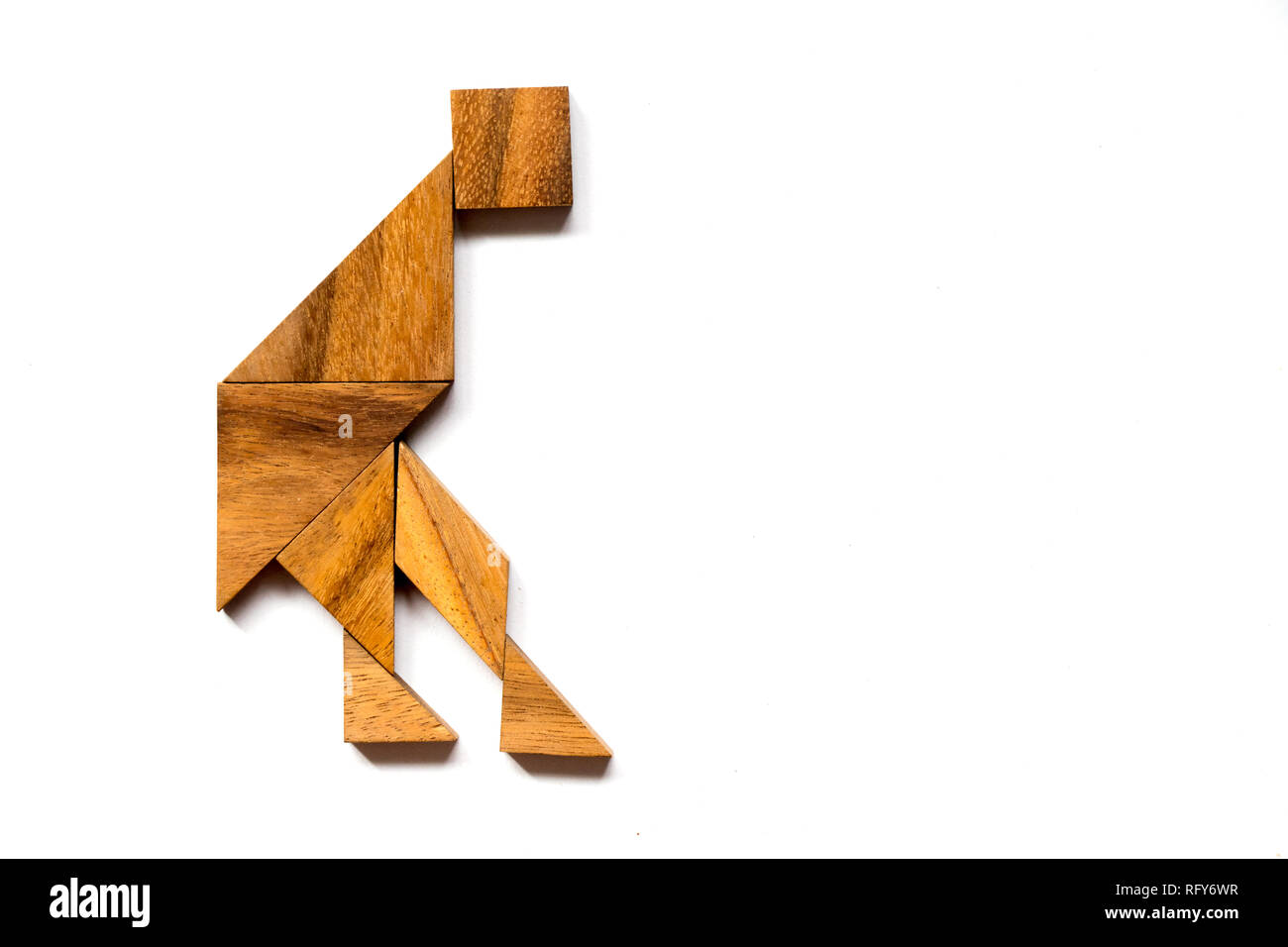 Wooden tangram puzzle in dancing man shape on white background Stock ...