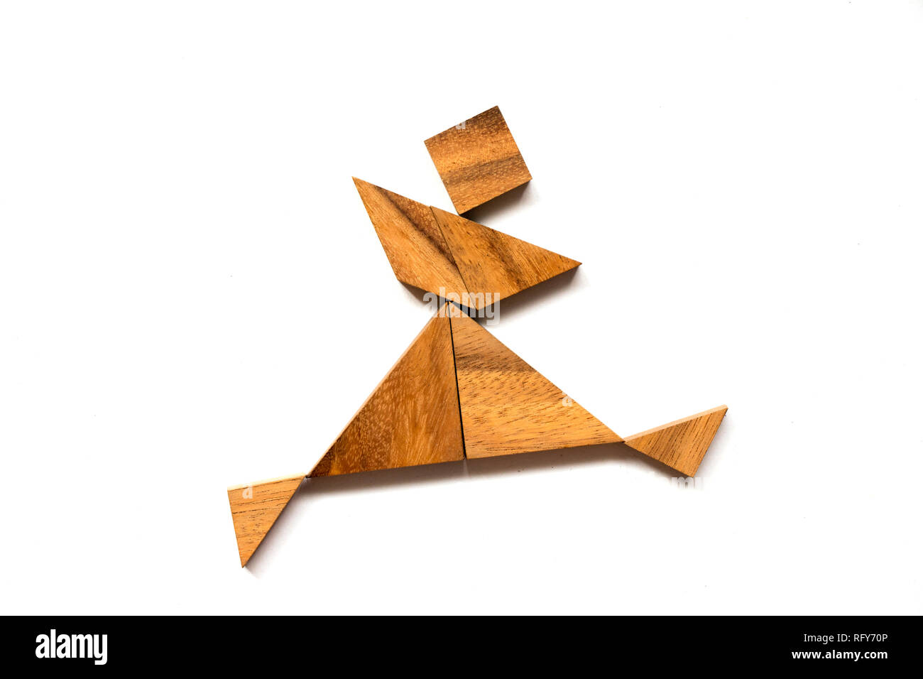 Wooden tangram puzzle in dancing man shape on white background Stock ...