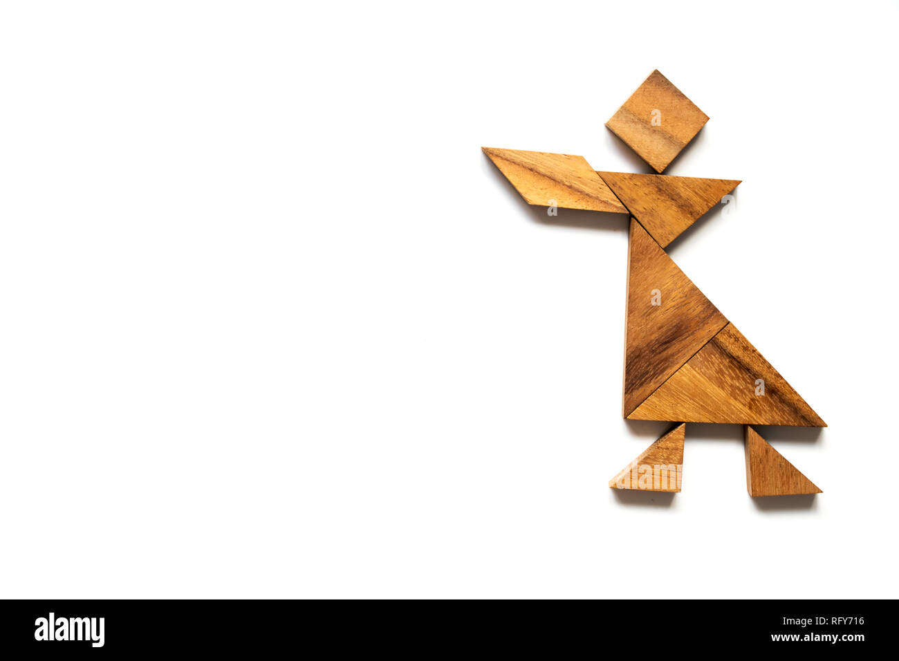 Wood tangram puzzle in singing man shape on white background Stock ...