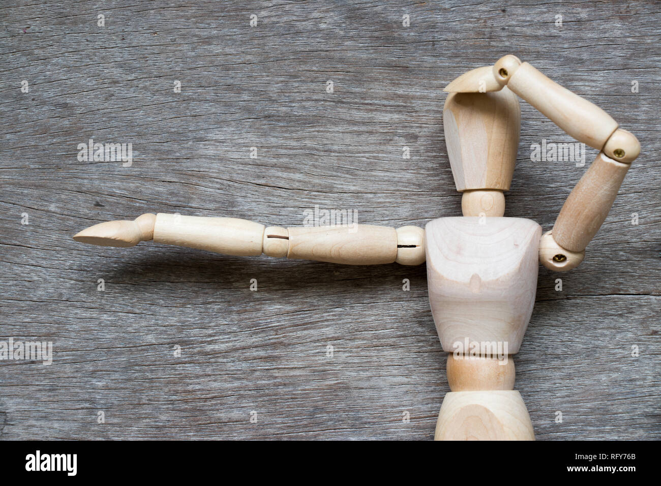 Wood figure doll pose in see and point in something and have the copy ...