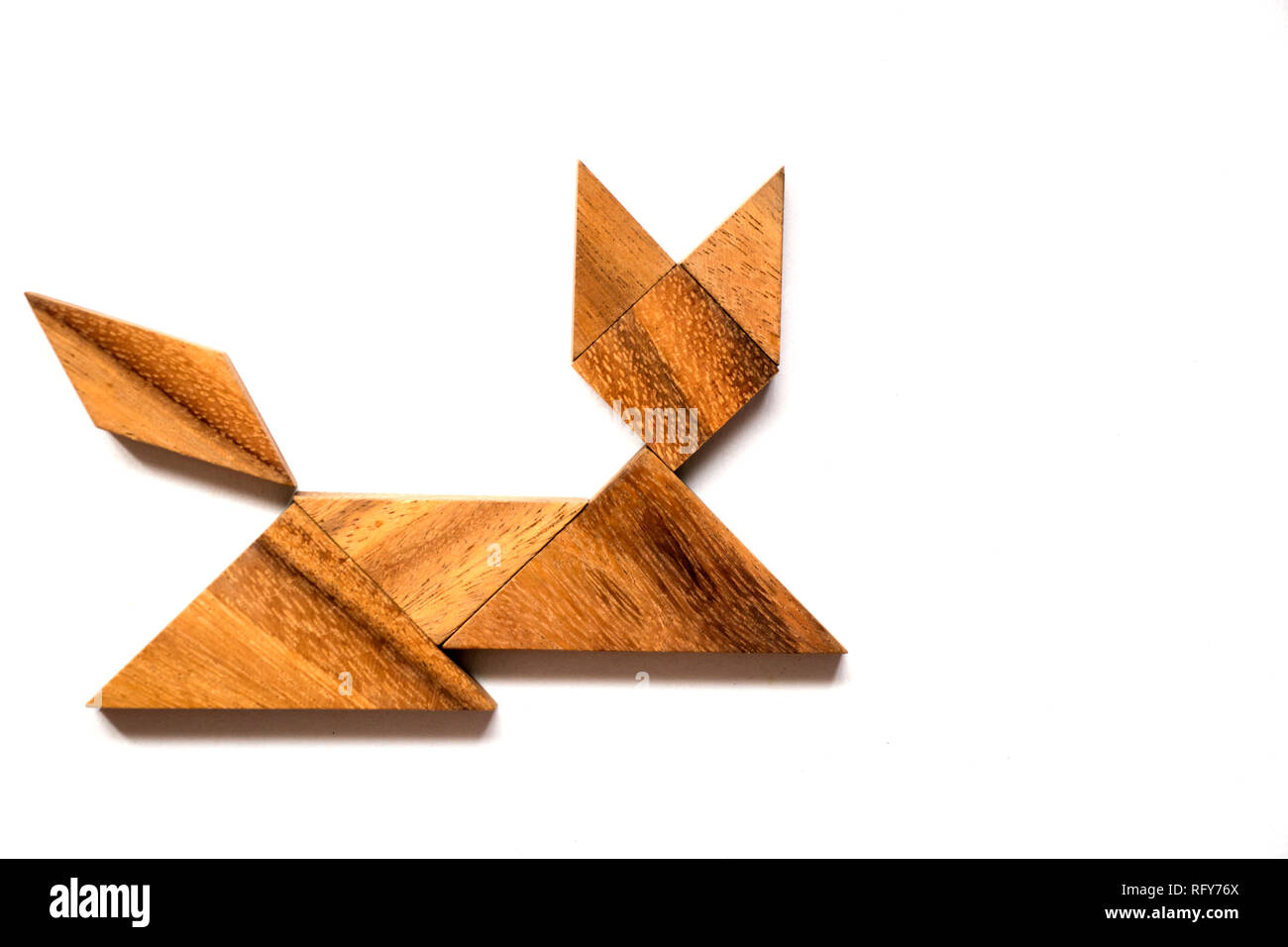 Wooden tangram puzzle in cat shape on white background Stock Photo - Alamy
