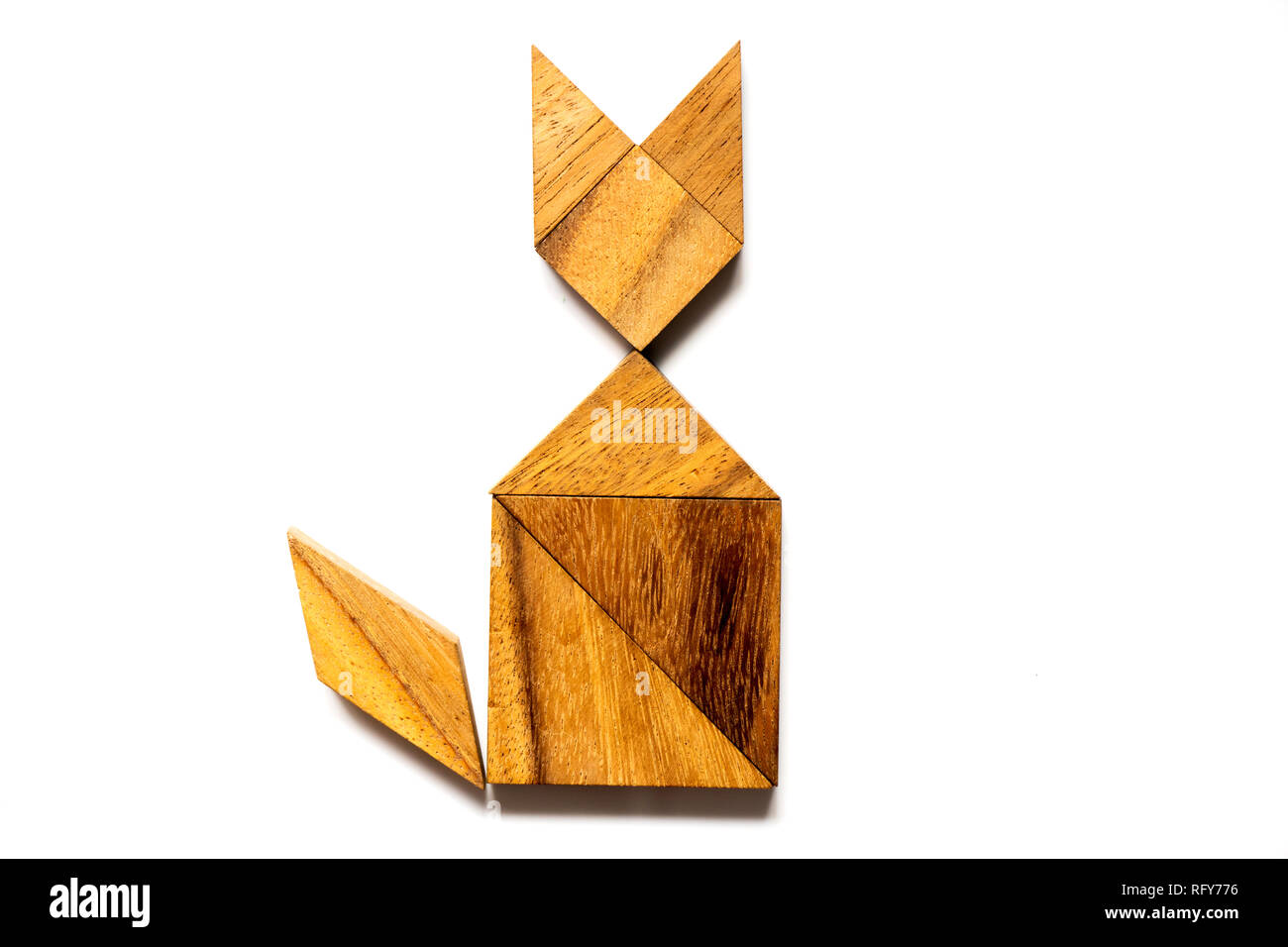 Wood tangram puzzle in cat sitting shape on white background Stock ...