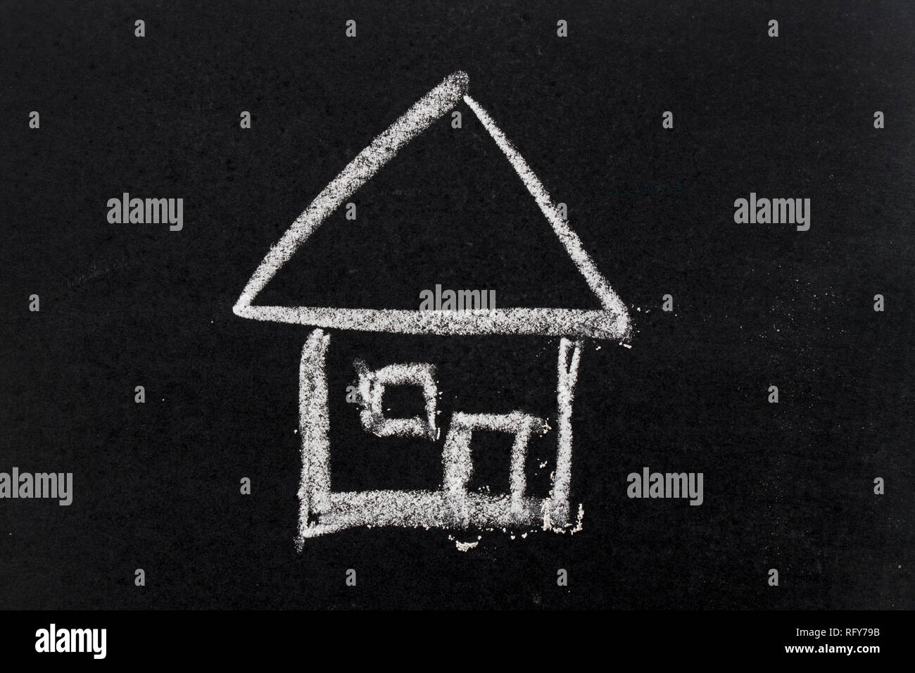 White chalk drawing as house shape on black board background (Concept ...